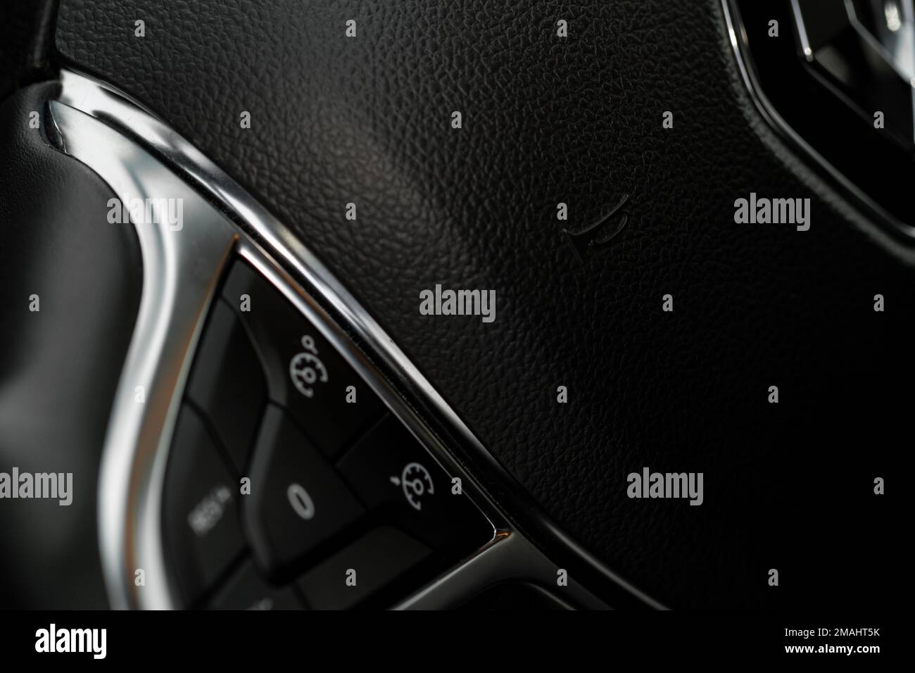Close up modern car steering wheel Stock Photo - Alamy
