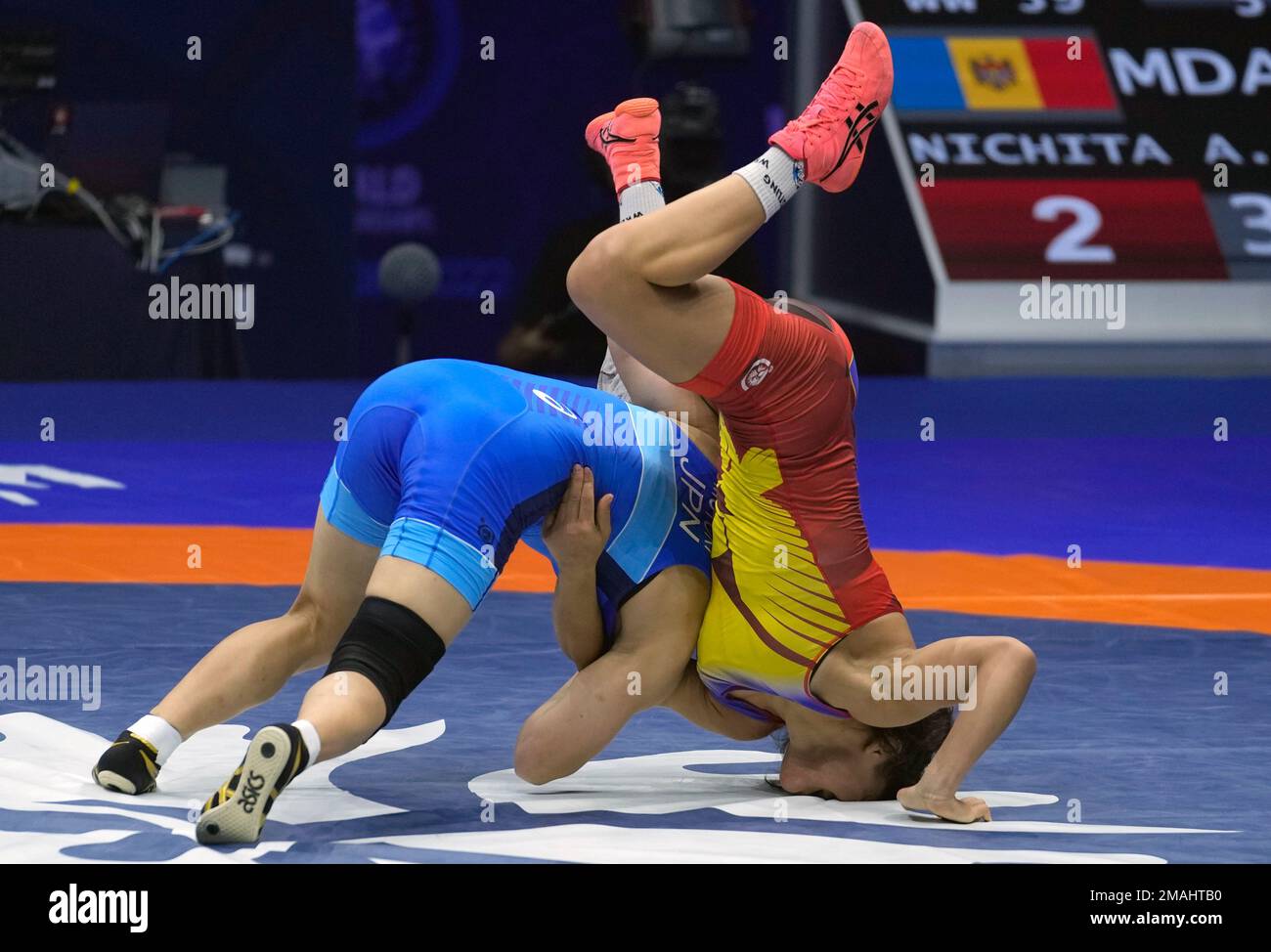 Japan's Sakura Motoki, left, and Moldova's Anastasia Nichita compete in ...