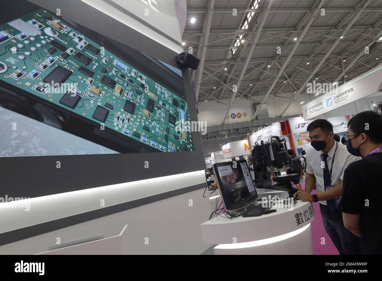 People visit the SEMICON TAIWAN 2022 trade fair at the Nangang ...