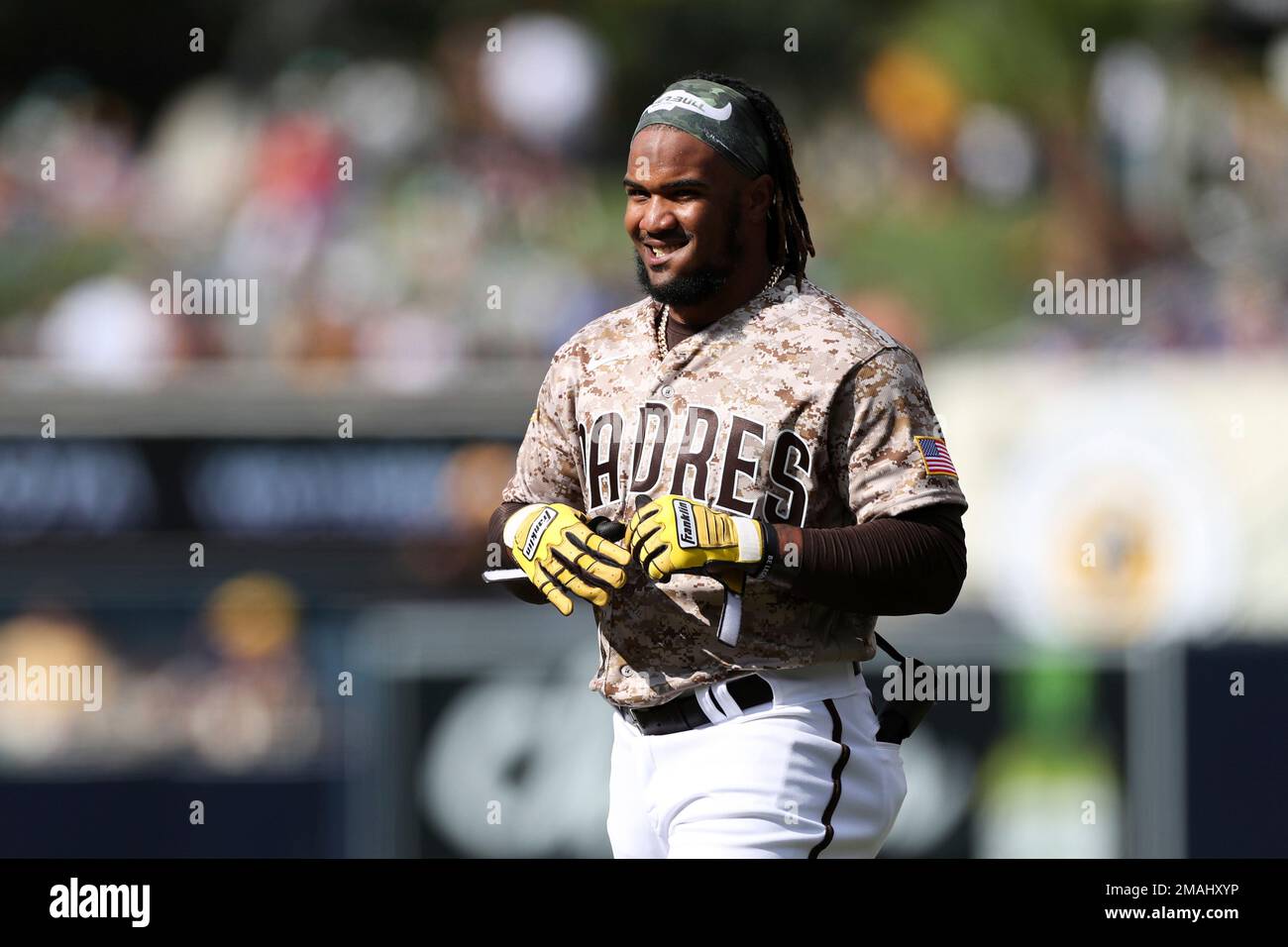 San Diego Padres' Eguy Rosario smiles after reaching first base on an ...