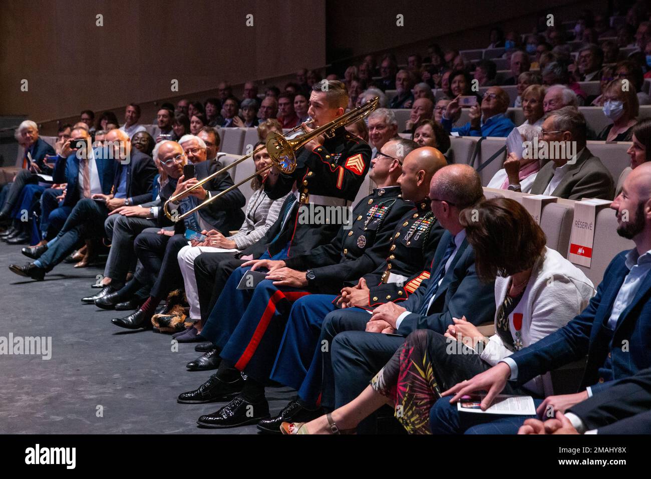 U.S. Marine Corps Sgt. George Nunn, a trombone instrumentalist, plays ...