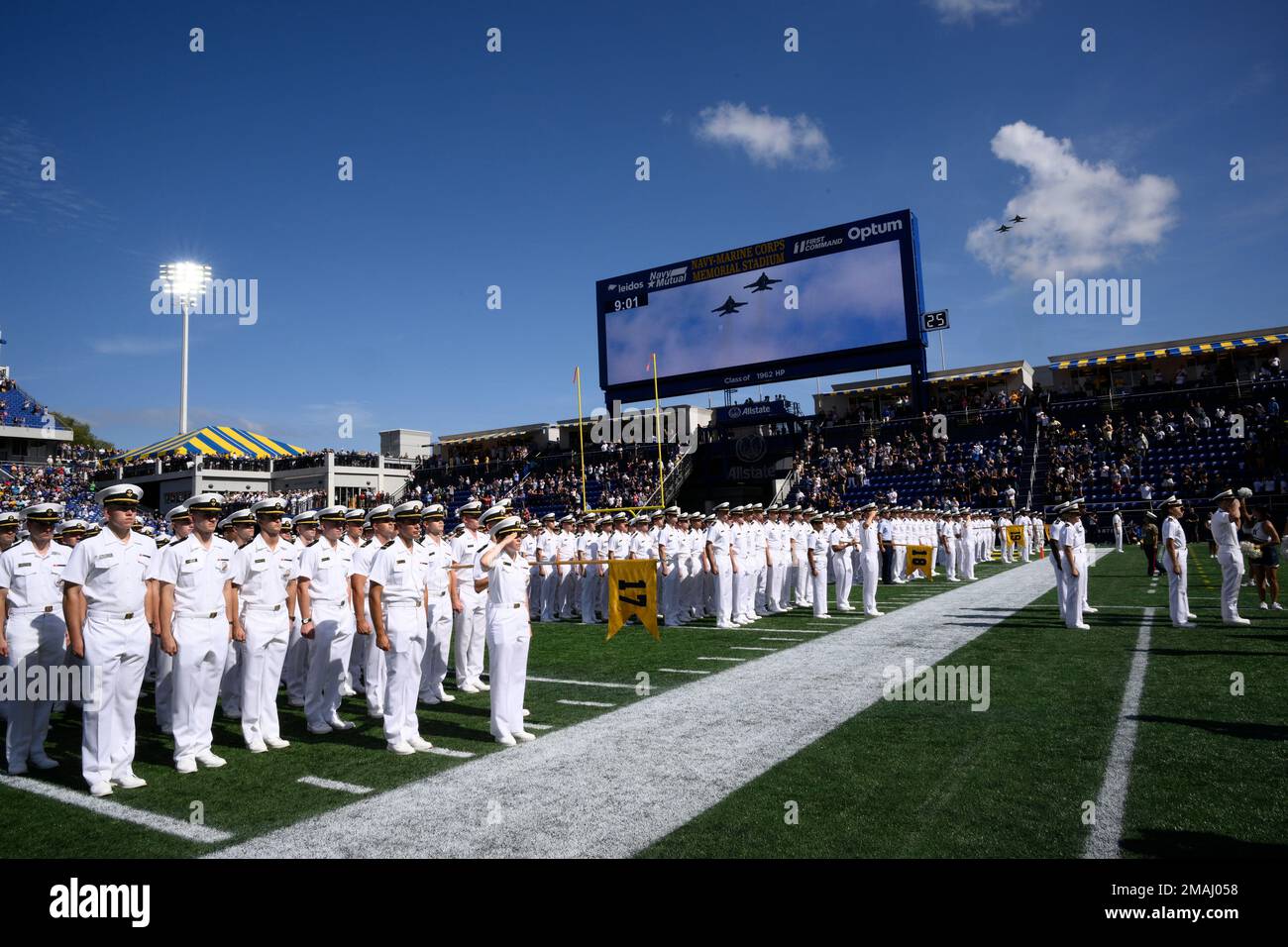 The brigade of midshipmen stand on the field before an NCAA college ...