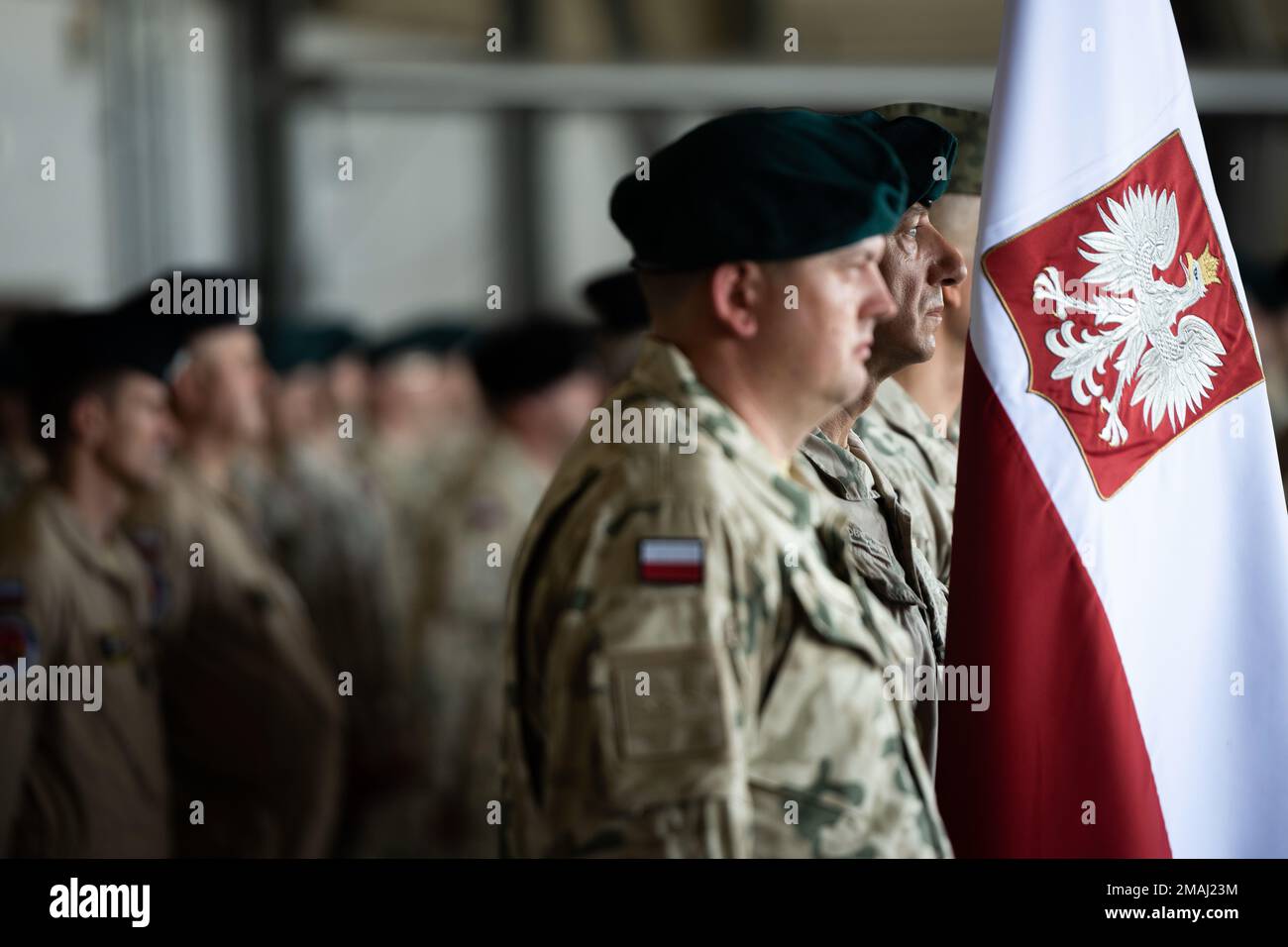 Members of the Polish Military Contingent participate in a change of ...