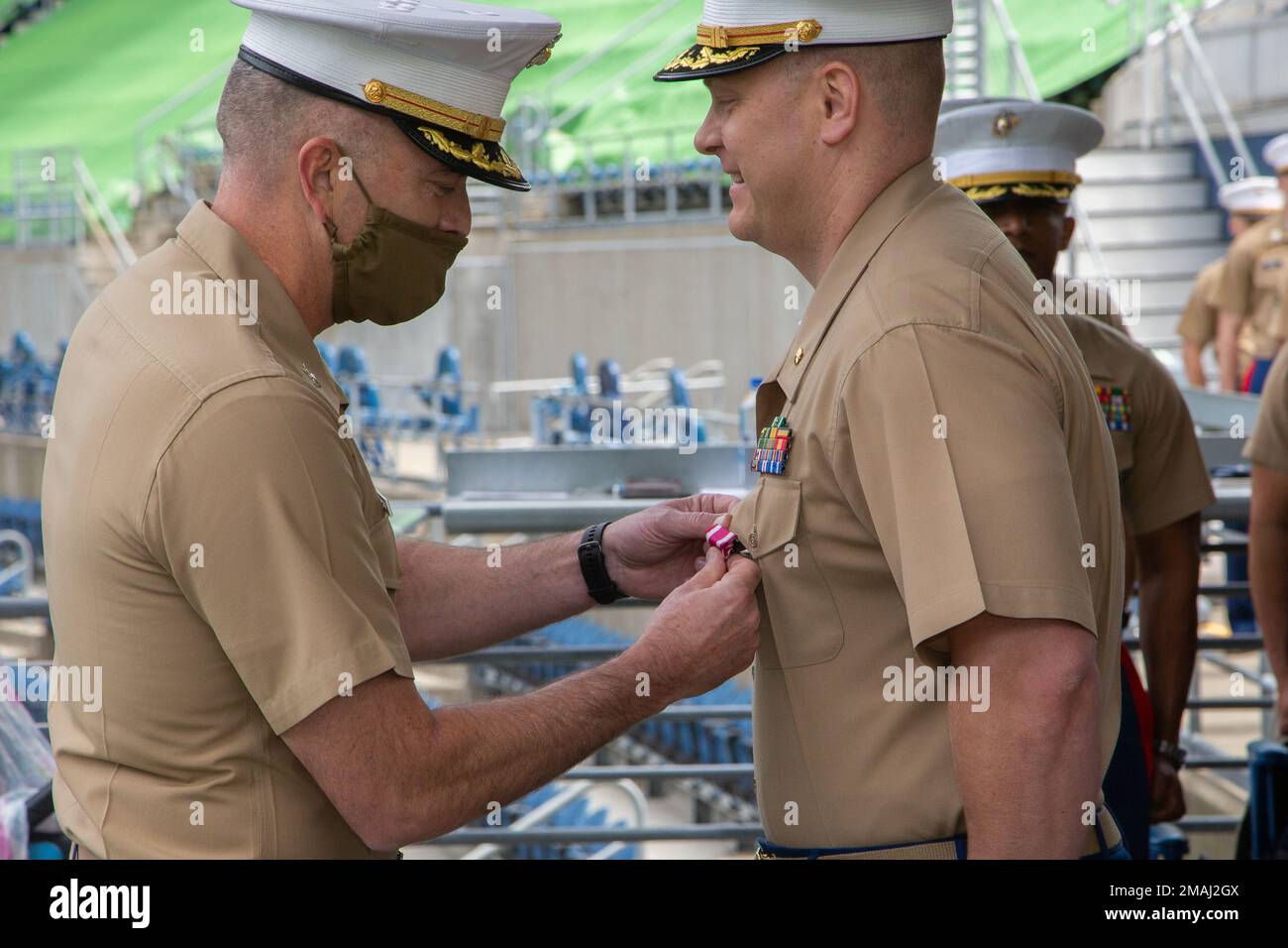 U.S. Marine Corps Maj. Cody Hardenburgh, right, the outgoing commanding ...