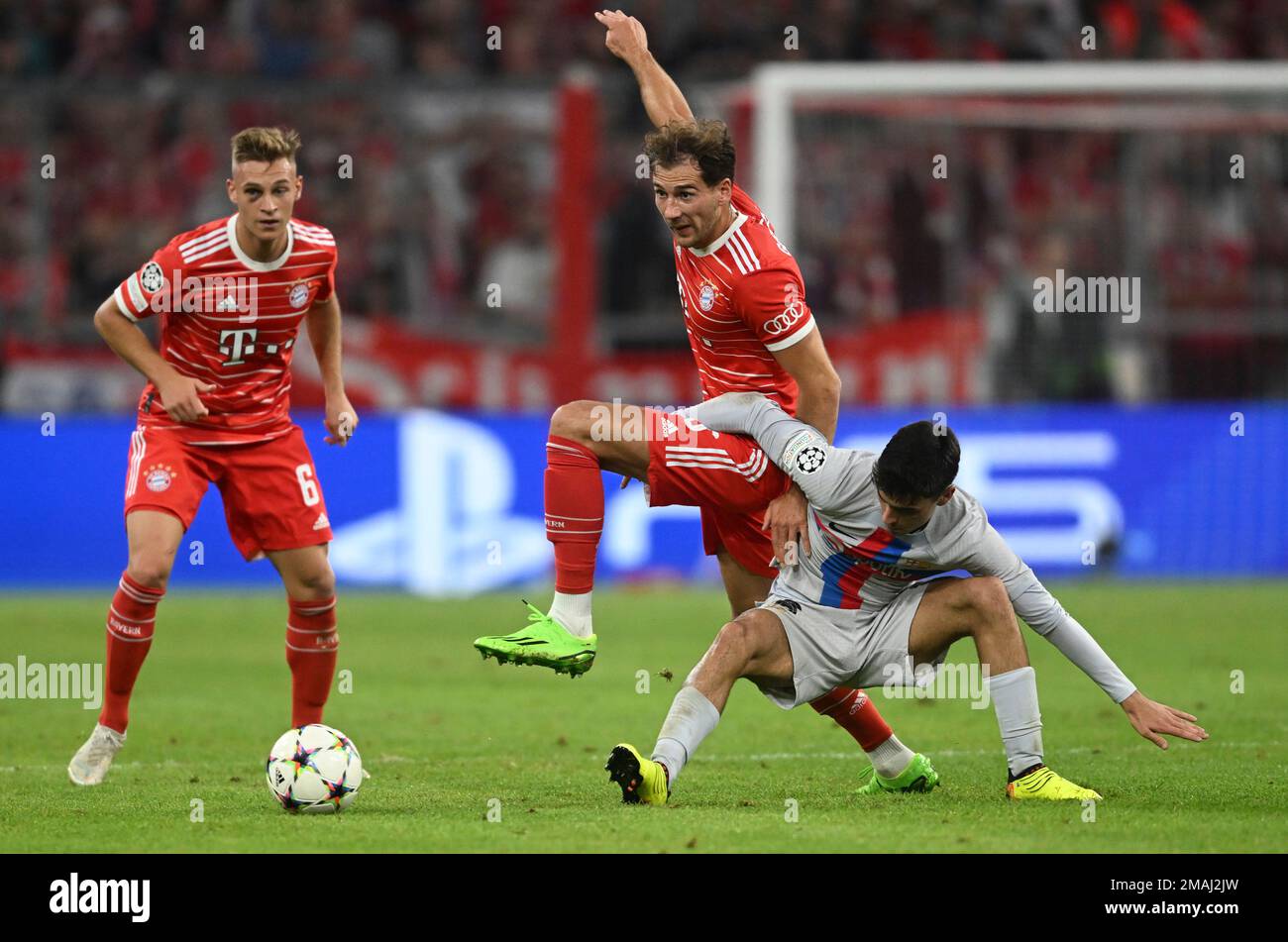 Barcelona's Pedri, right, Bayern's Leon Goretzka, centre, Bayern's ...