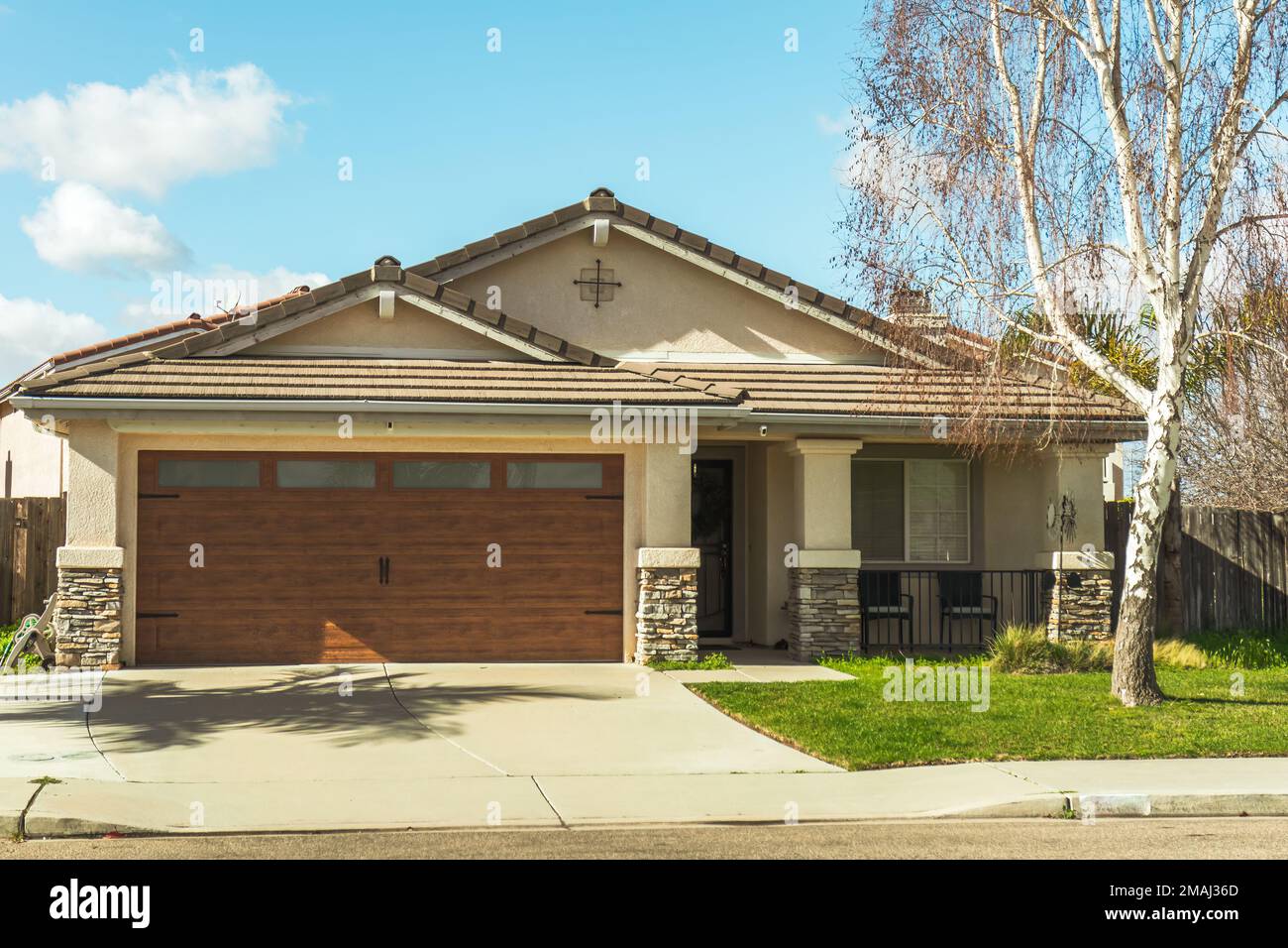 Beautiful houses with nicely landscaped front the yard in small town in ...