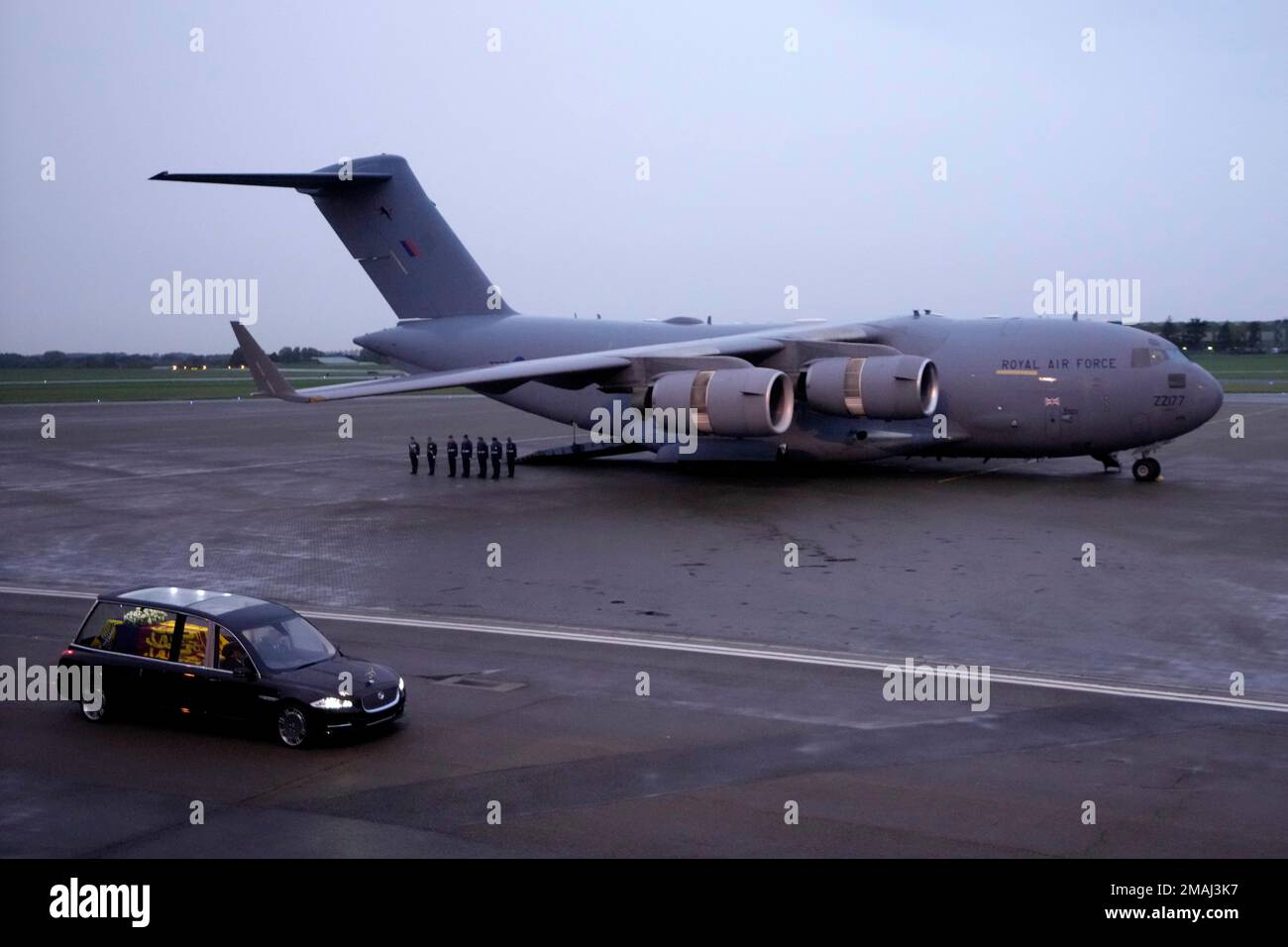 The coffin of Queen Elizabeth II is carried off a plane by the Queen's ...