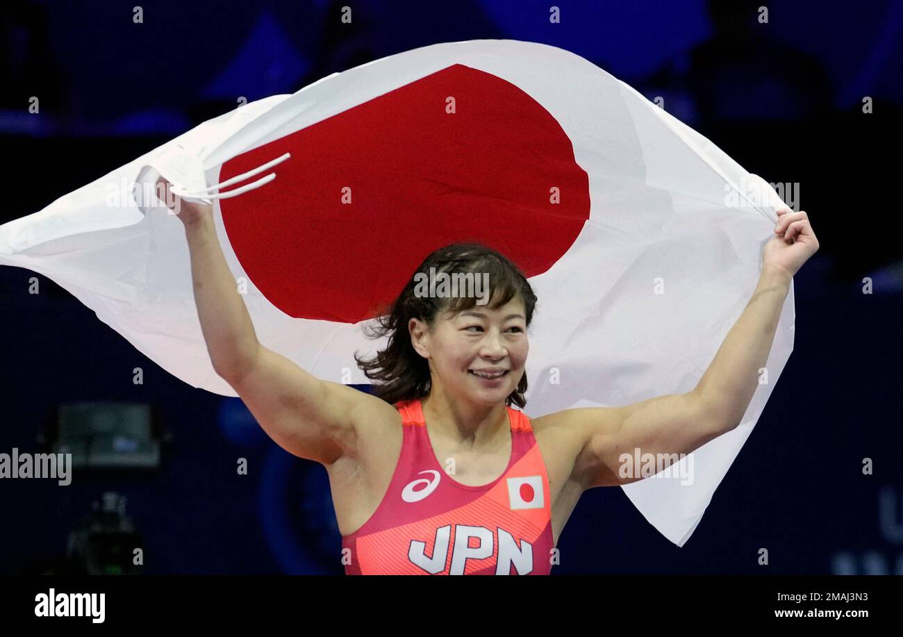 Japan's Mayu Shidochi Mukaida celebrates after the women's freestyle 55 ...