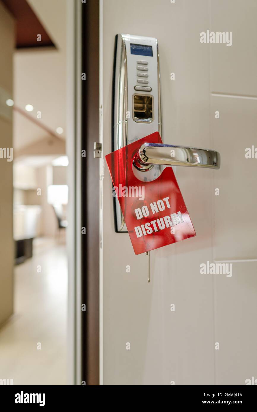 Close up on the opened door with modern key lock of hotel motel room ...