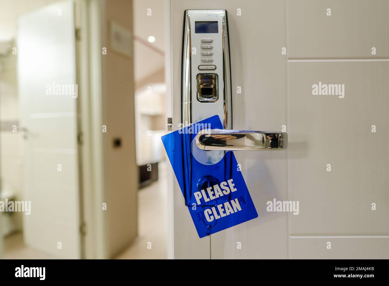 Close up on the opened door with modern key lock of hotel motel room ...