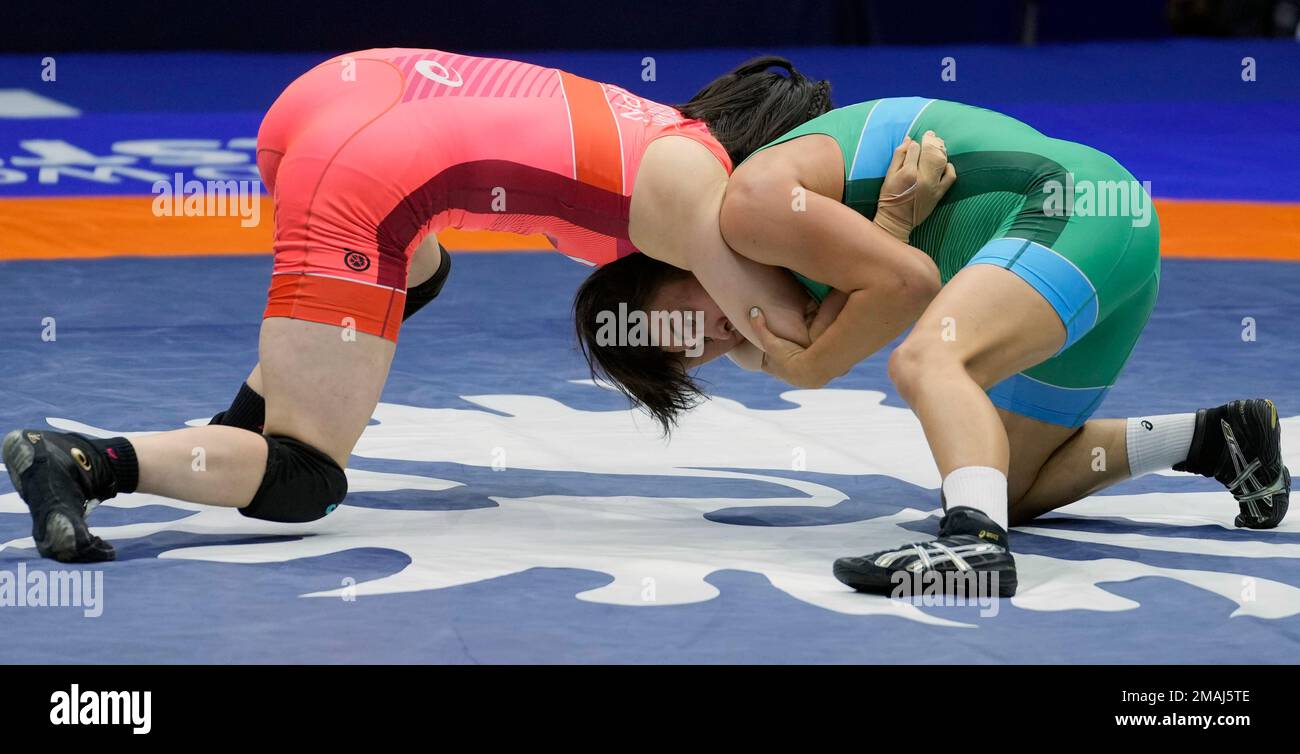 Japan's Miwa Morikawa, left, and Bulgaria's Mimi Hristova compete in ...
