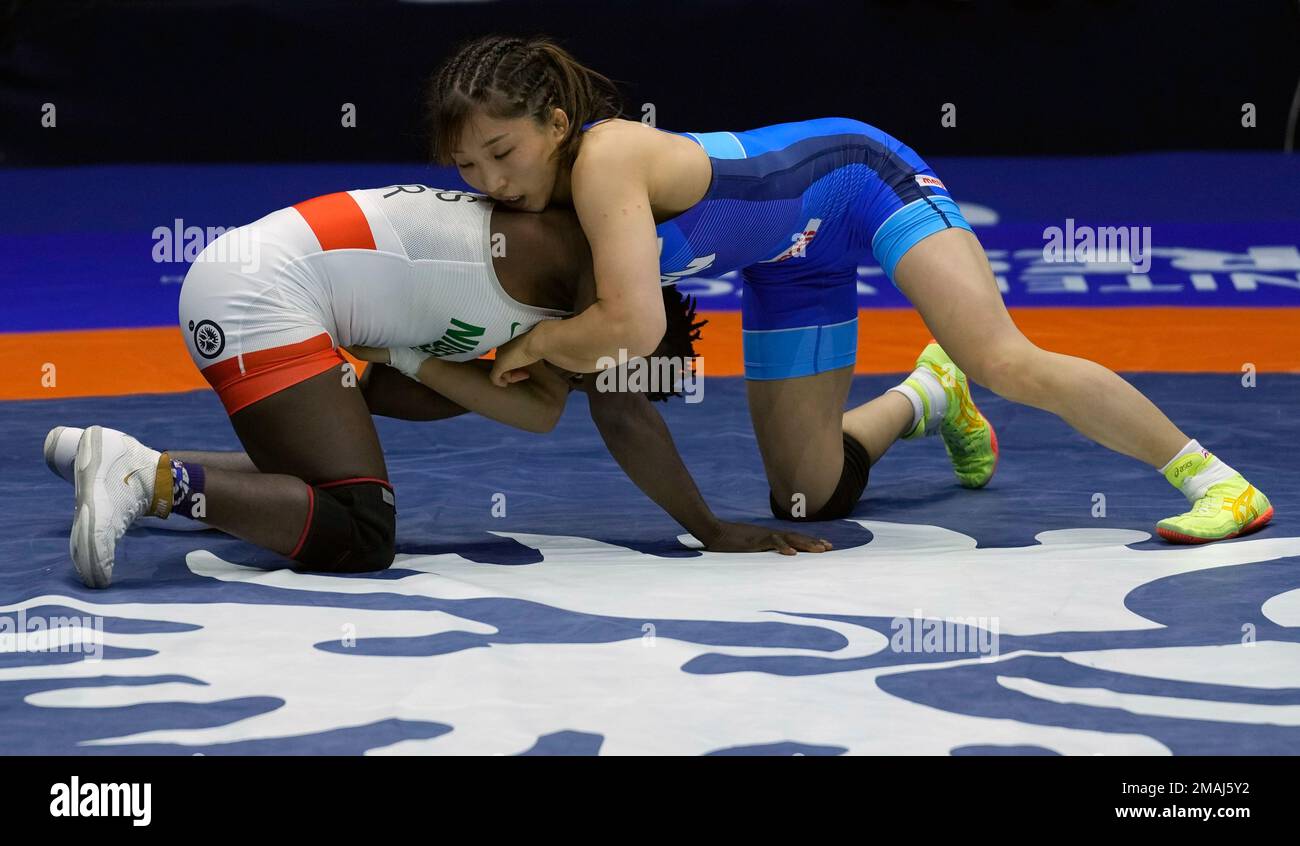 Japan's Yui Susaki, right, and Nigeria's Miesinnei Genesis compete in ...
