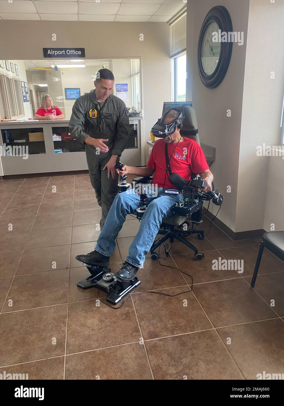 Capt. Knapp assists a Black Pilots of America member operate the mobile ...