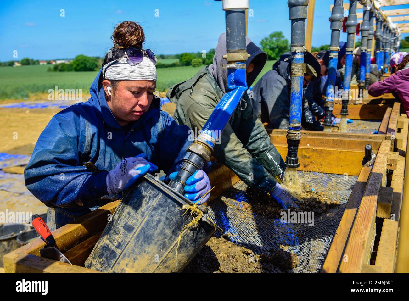 Members of a Defense POW/MIA Accounting Agency (DPAA) recovery team ...