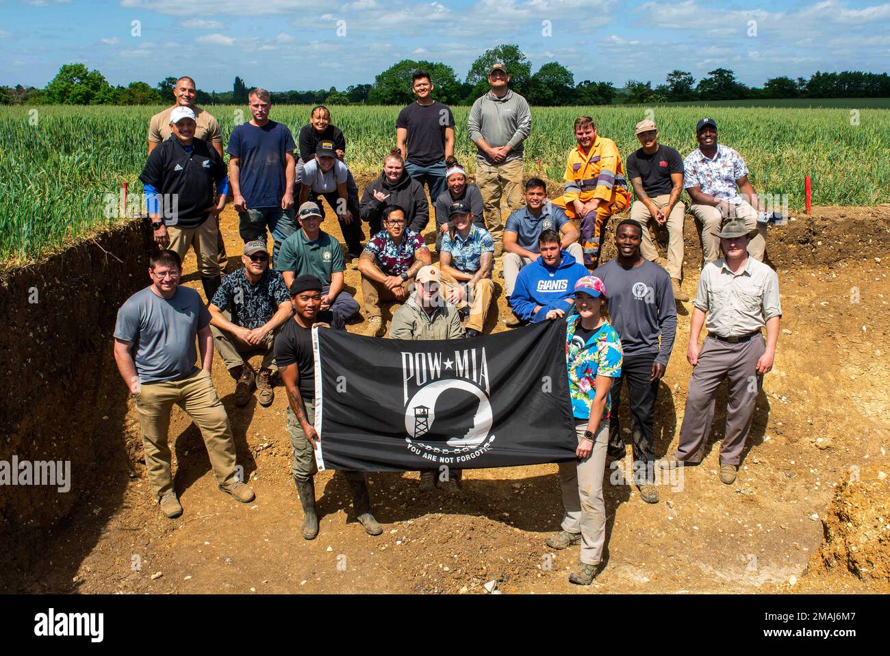 Members of a Defense POW/MIA Accounting Agency (DPAA) recovery team ...