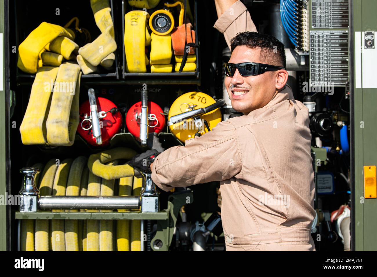 U.S. Marine Corps Cpl. Marcelo Moreira-Mejia, a firefighter technician ...