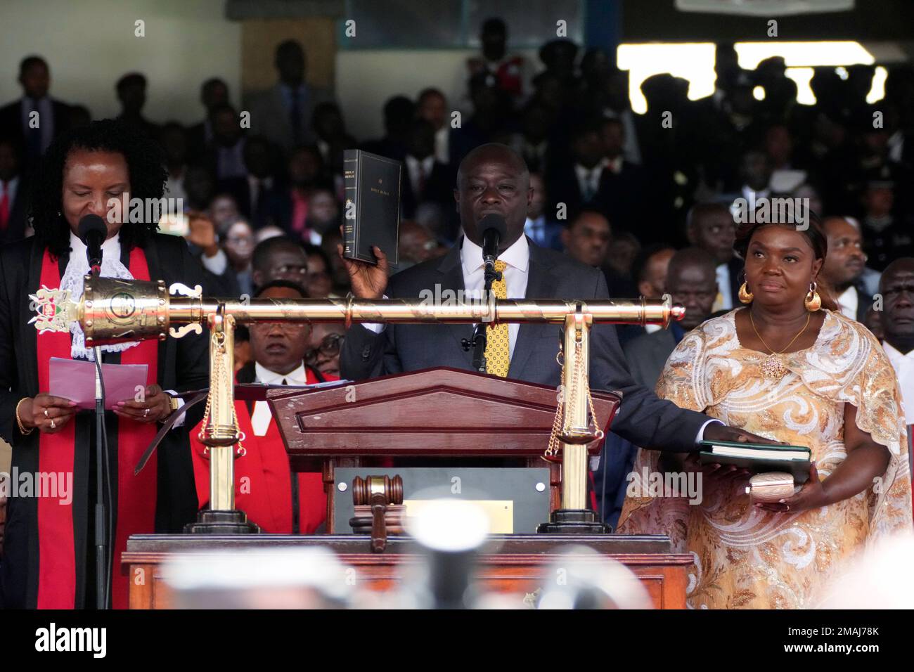 Kenya's Deputy President Rigathi Gachagua holds a bible as he is being ...