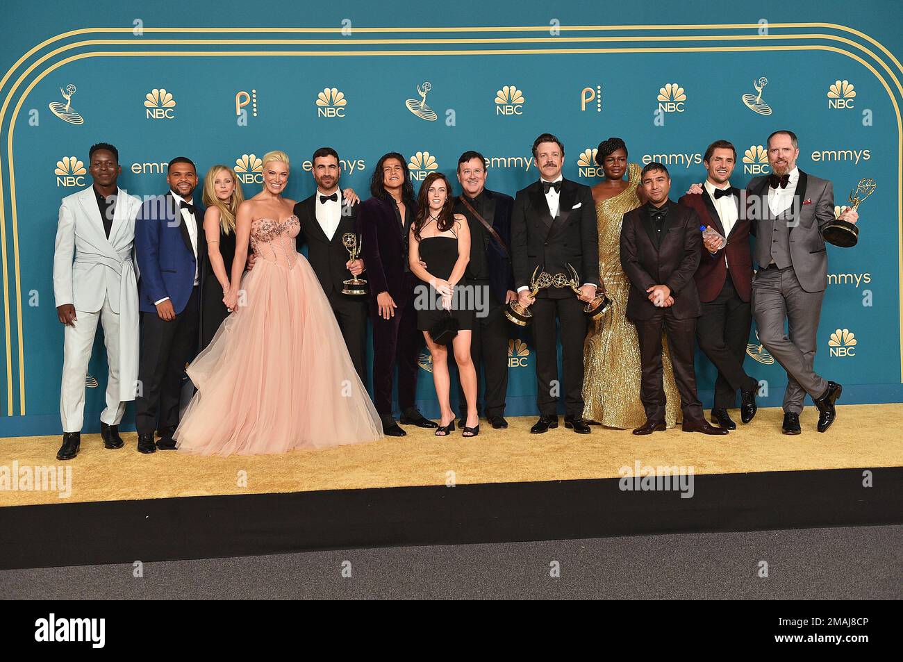 The team from "Ted Lasso" pose with their Emmy at the 74th Emmy Awards ...