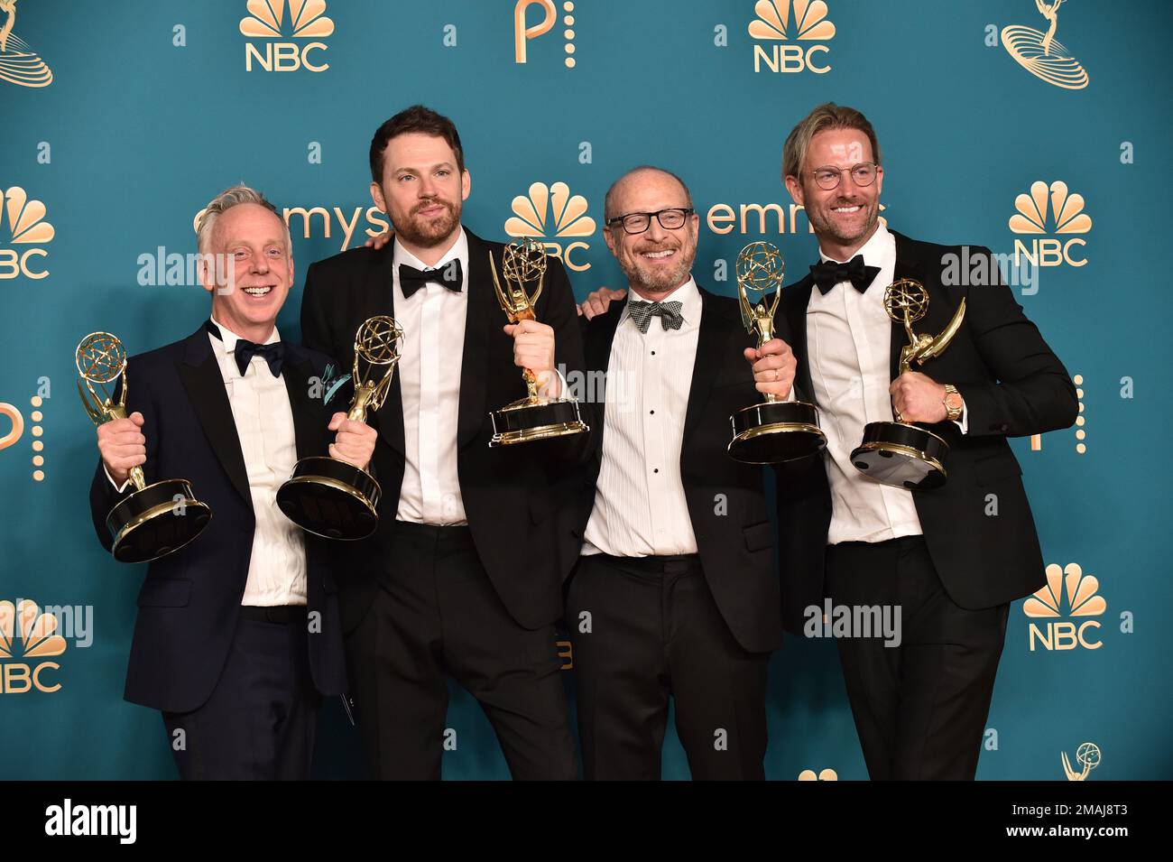 Mike White, from left, David Bernad, Nick Hall, and Mark Kamine pose with the Emmy for ...