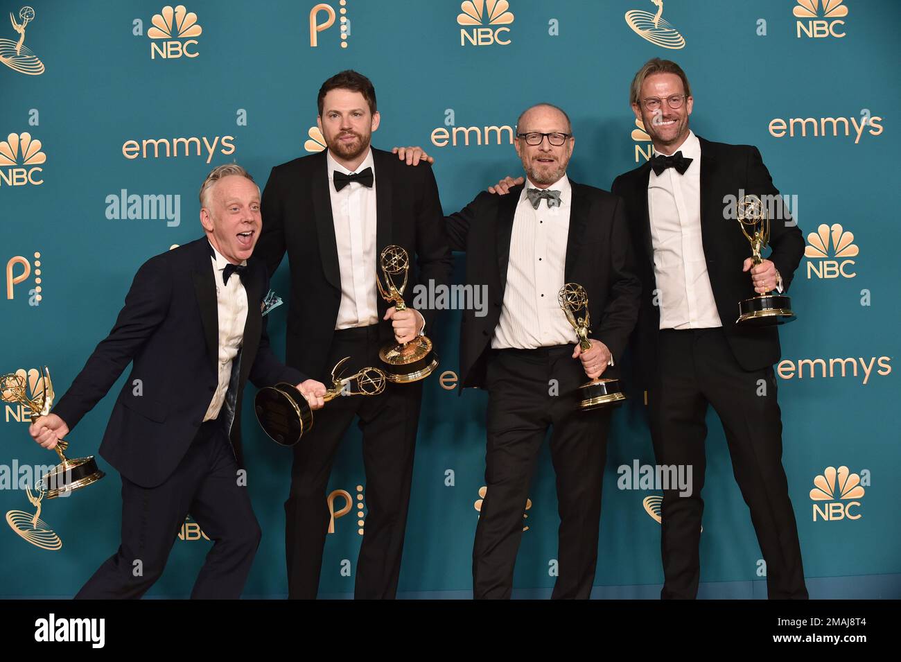 Mike White, from left, David Bernad, Nick Hall, and Mark Kamine pose ...