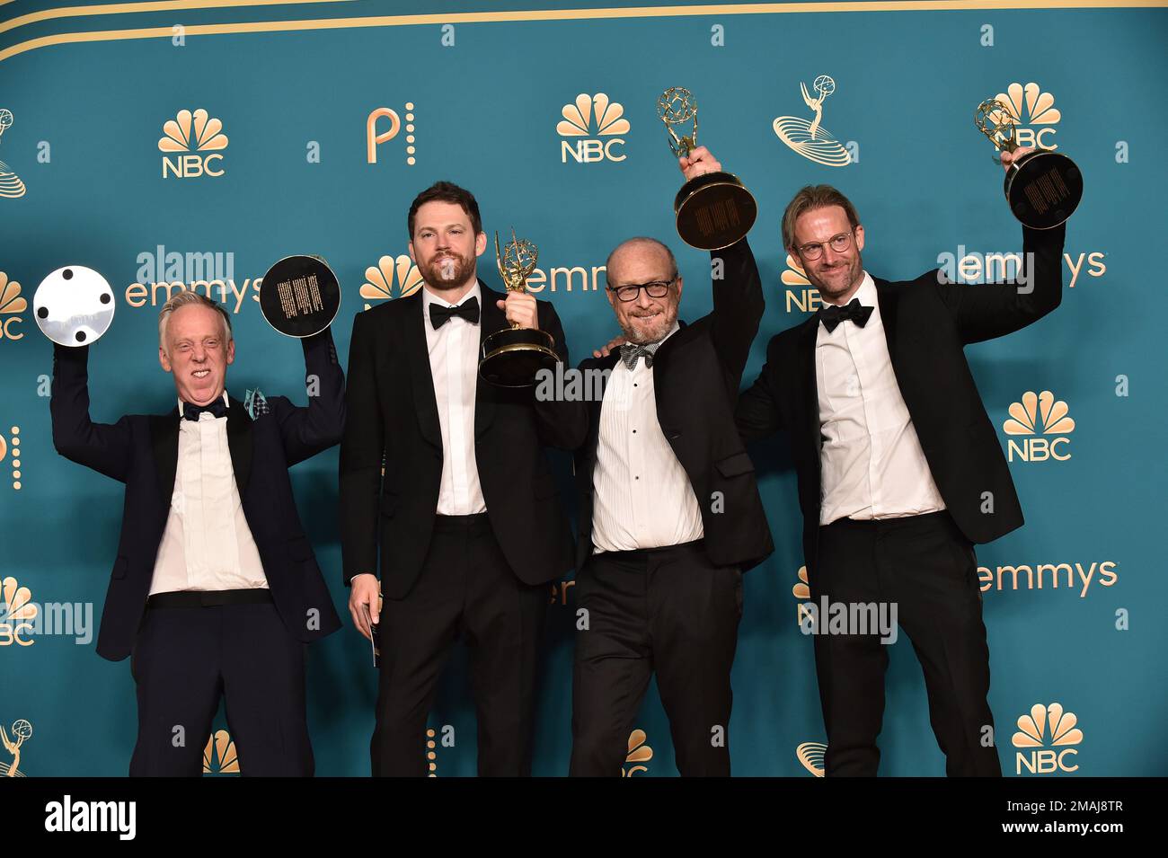 Mike White, from left, David Bernad, Nick Hall, and Mark Kamine pose ...