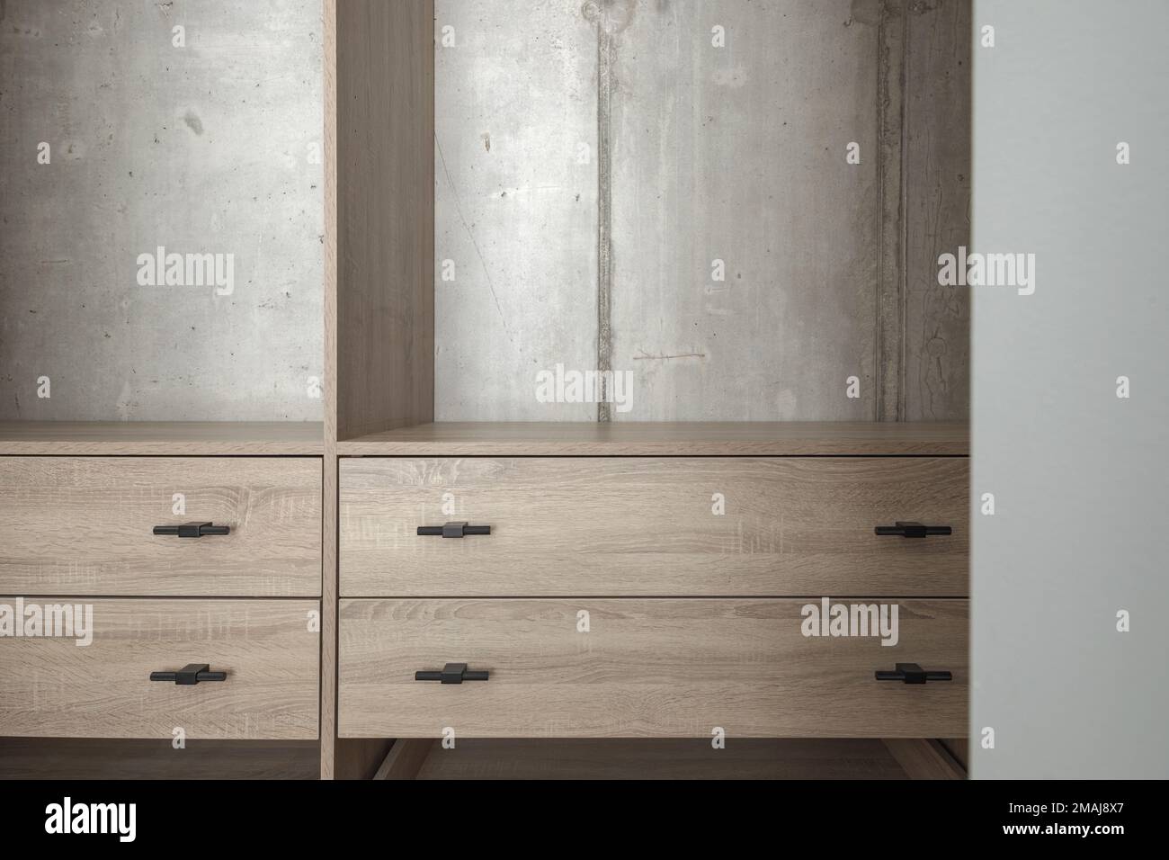 Empty contemporary wooden wardrobe design with concrete wall Stock ...