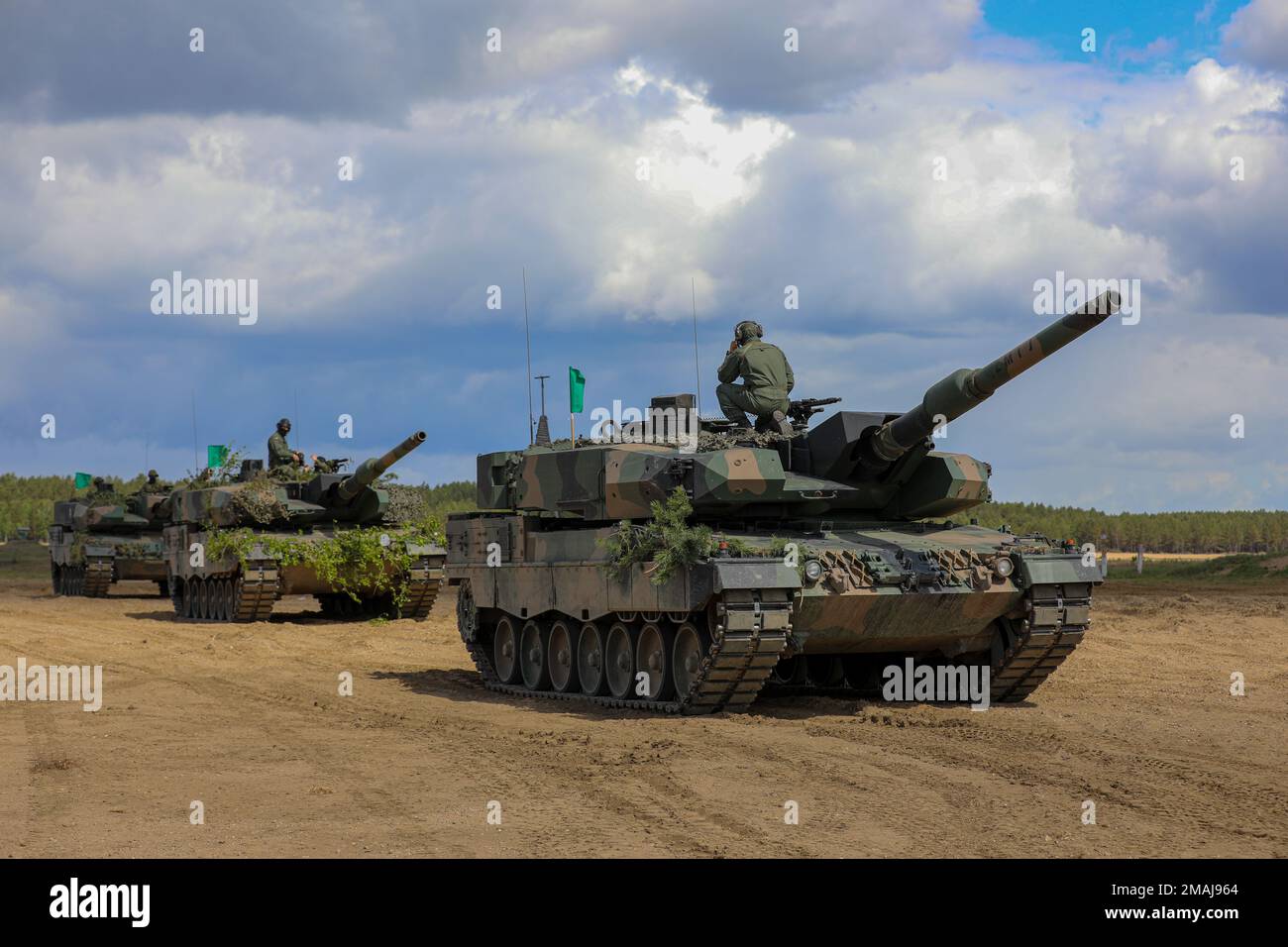 Polish army Leopard 2PL tanks prepare to advance onto the field during ...