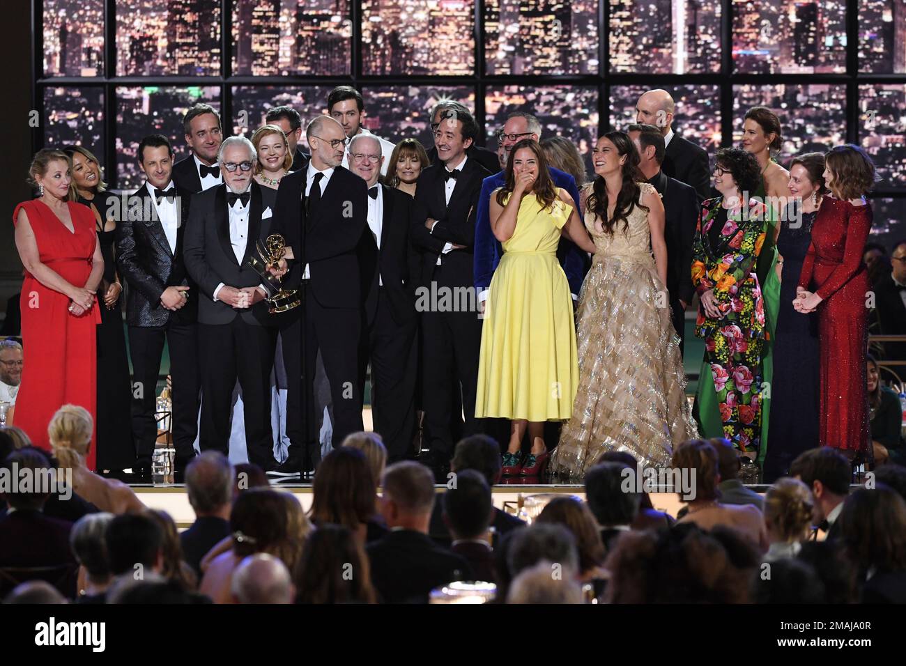 Jesse Armstrong, speaking, and the team from "Succession" accept the ...