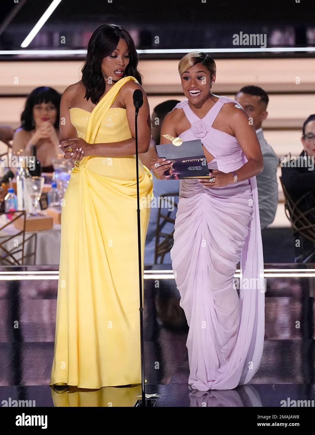 Angela Bassett, left, and Ariana DeBose present the Emmy for ...