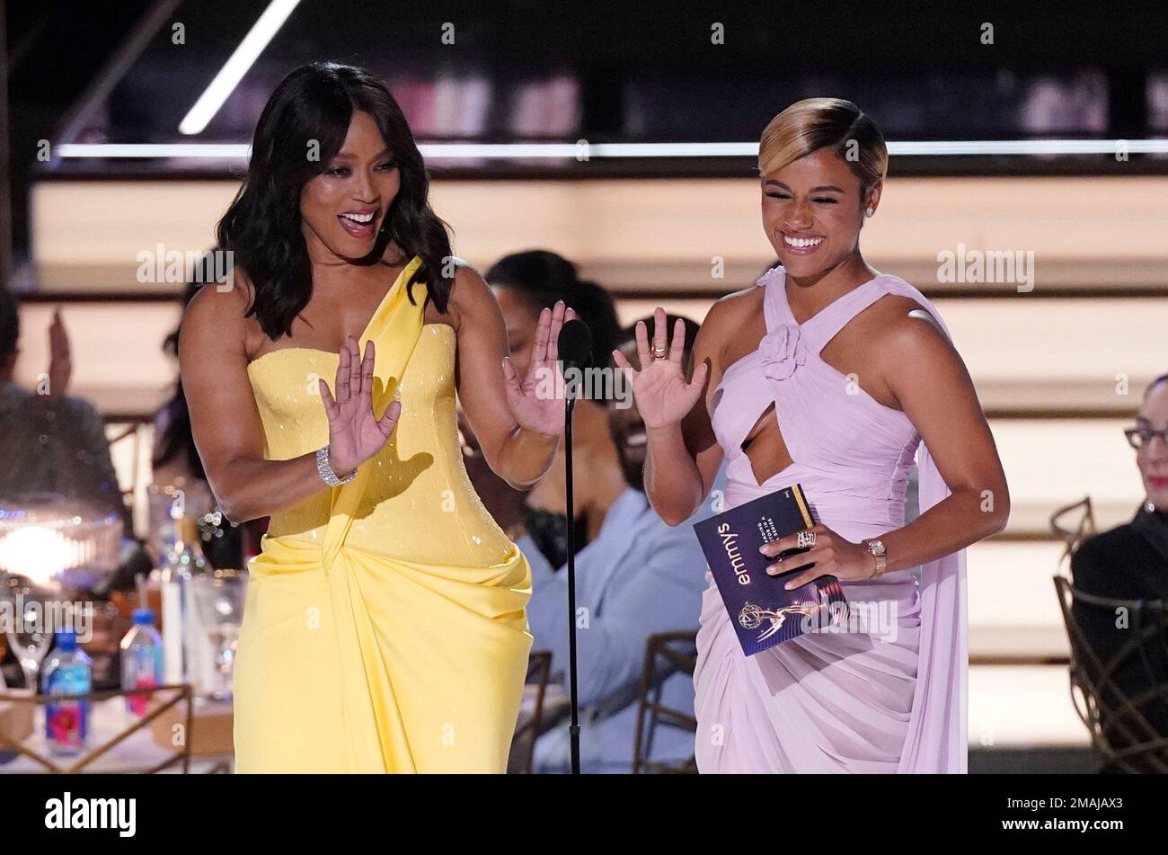 Angela Bassett, left, and Ariana DeBose present the Emmy for ...