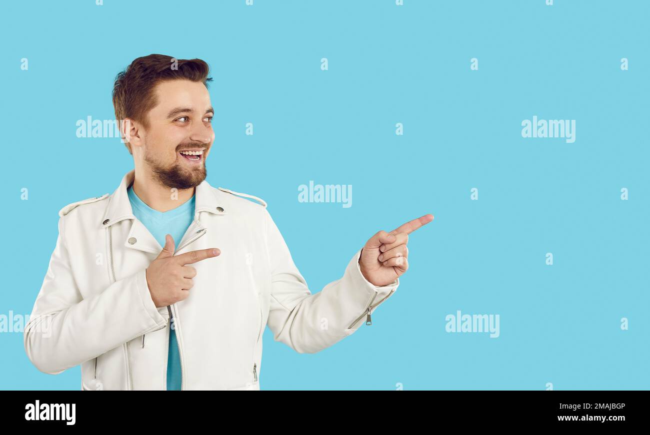 Man recommend good offer or promotion deal pointing at copy space on ...