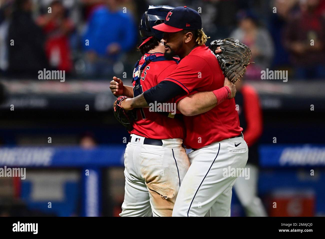 Cleveland Guardians relief pitcher Emmanuel Clase, right, hugs catcher ...