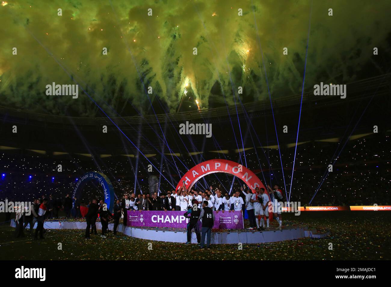 Iraq's national football team players celebrate with the trophy on the ...