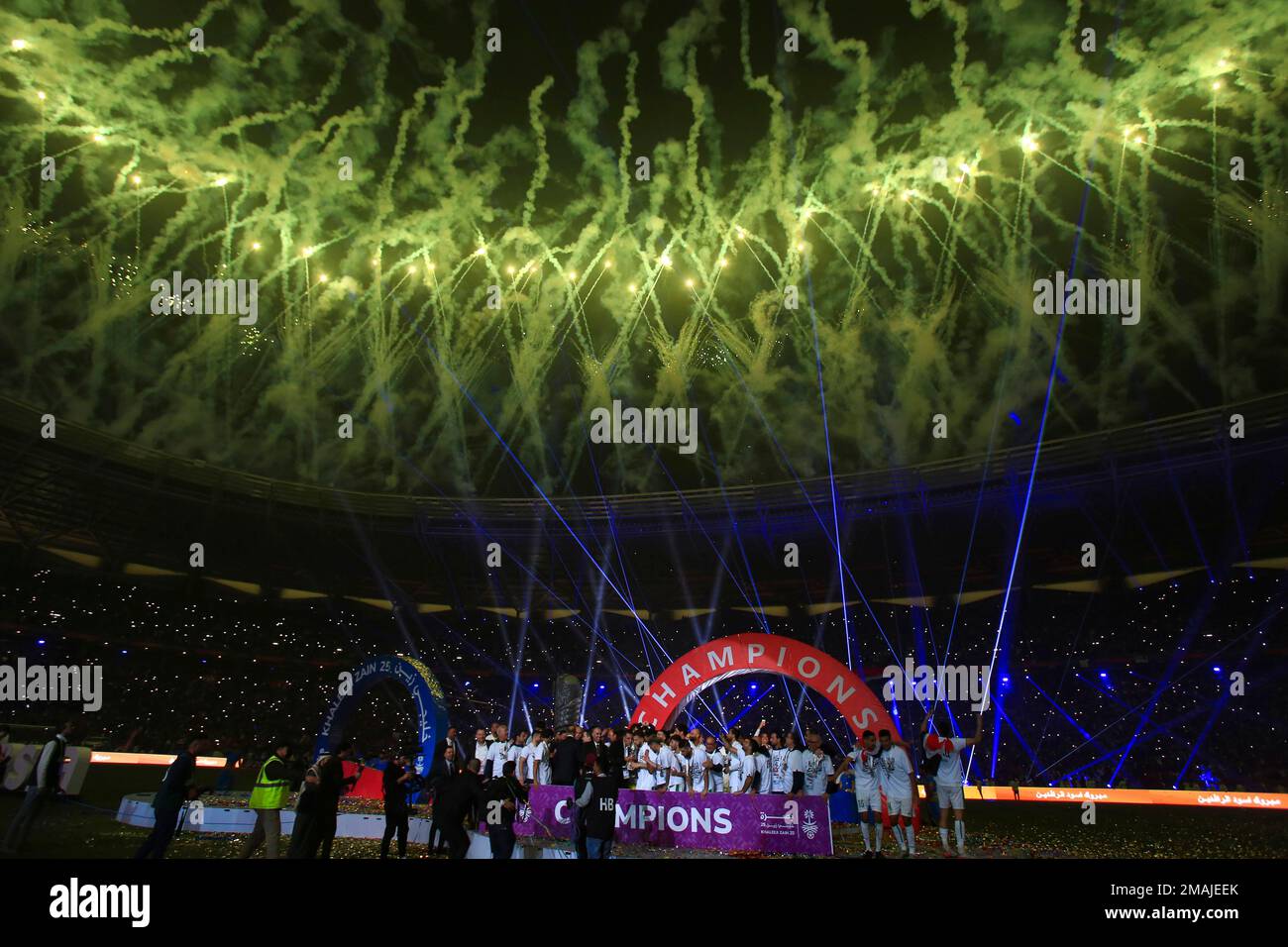 Iraq's national football team players celebrate with the trophy on the ...