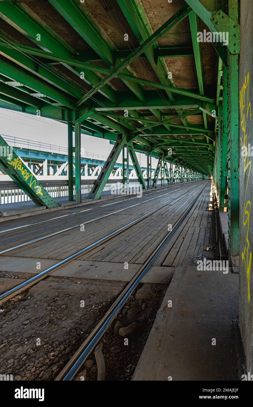 Warsaw, Poland - March 2022: Long wooden and metal Gdanski bridge with ... Warsaw, Poland - March 2022: Long wooden and metal Gdanski bridge with ...