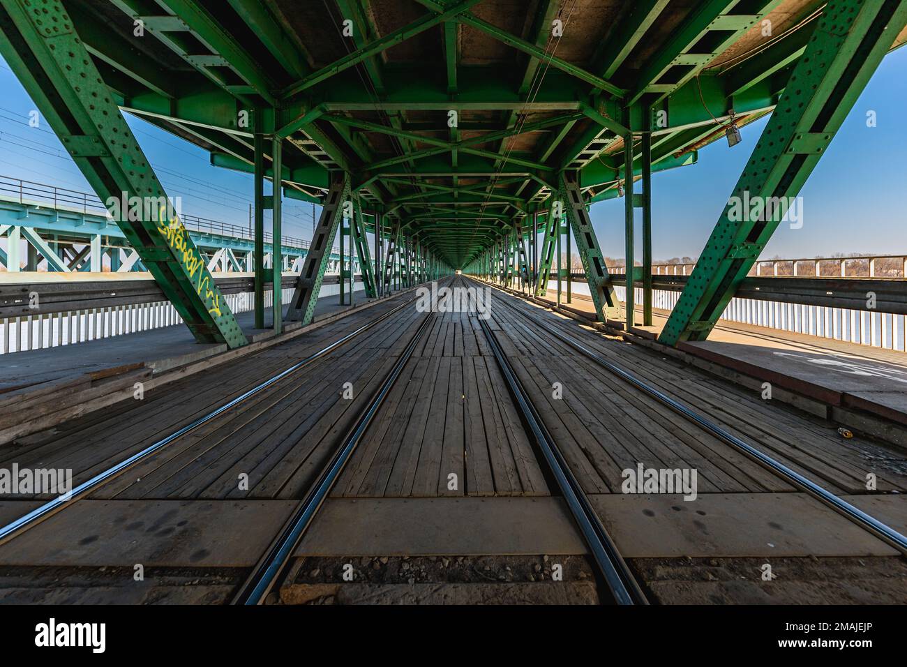 Warsaw, Poland - March 2022: Long wooden and metal Gdanski bridge with ... Warsaw, Poland - March 2022: Long wooden and metal Gdanski bridge with ...