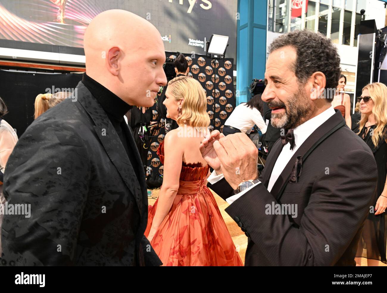 Anthony Carrigan, left, and Tony Shalhoub arrive at the 74th Emmy ...