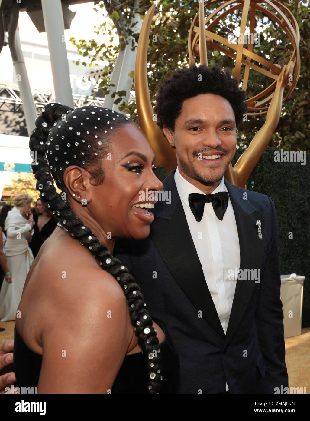 Sheryl Lee Ralph, left, and Trevor Noah arrive at the 74th Emmy Awards ...