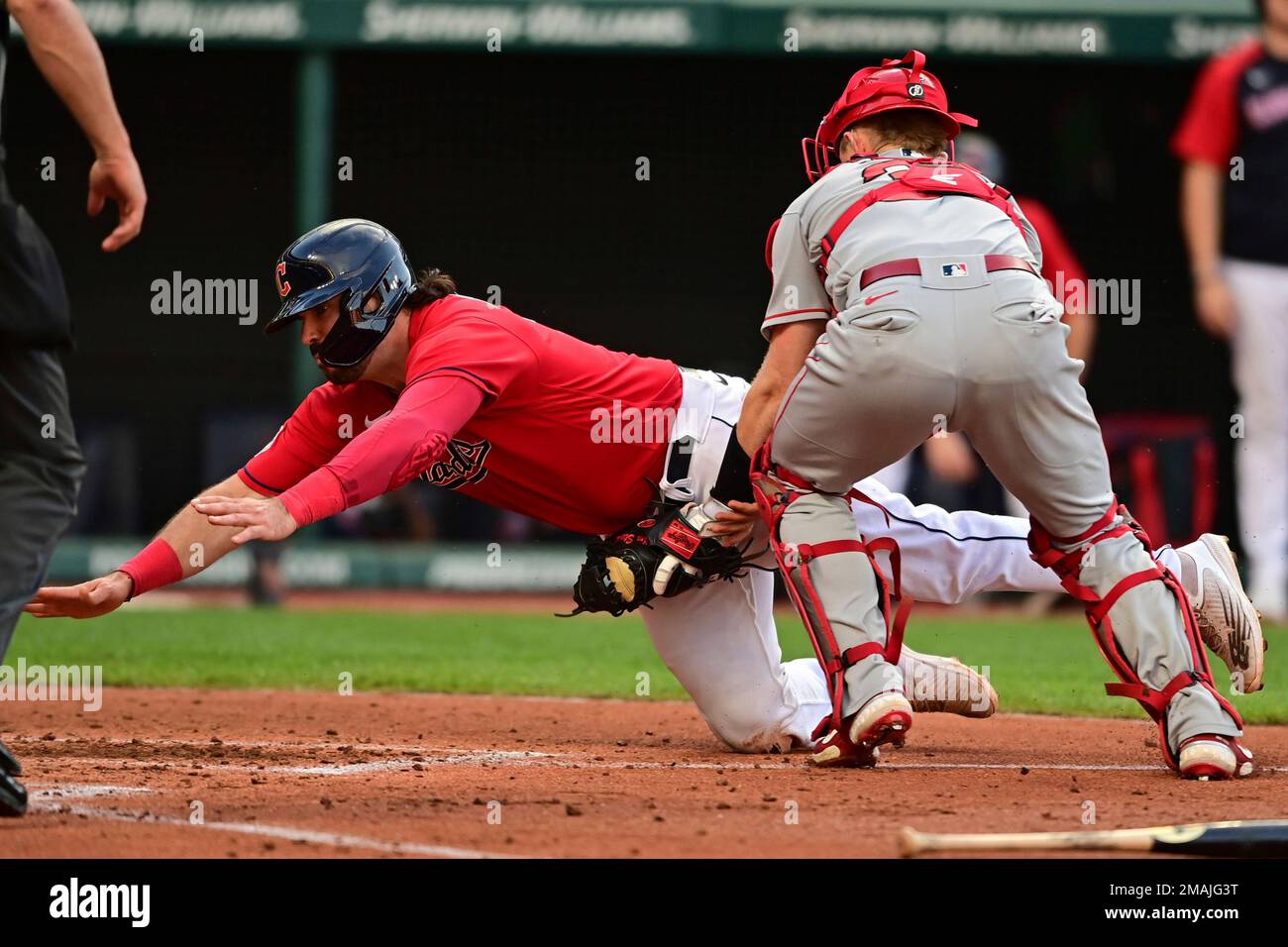 Cleveland Guardians' Austin Hedges sides to score a run as Los Angeles ...