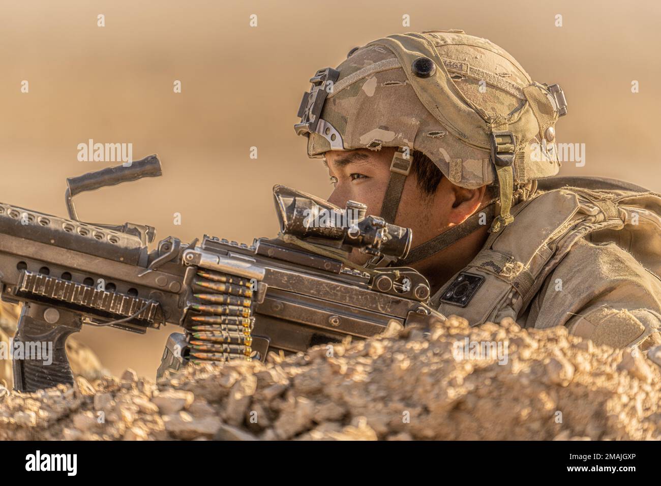 U.S. Army Trooper Spc. Andy Chau, a Squad Automatic Weapon gunner ...