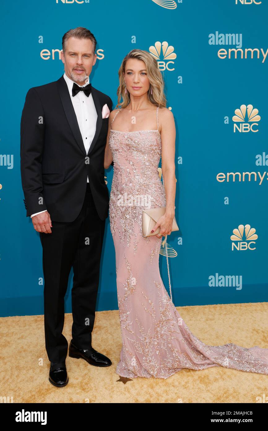 Travis Schuldt, left, and Natalie Zea arrive at the 74th Emmy Awards on ...