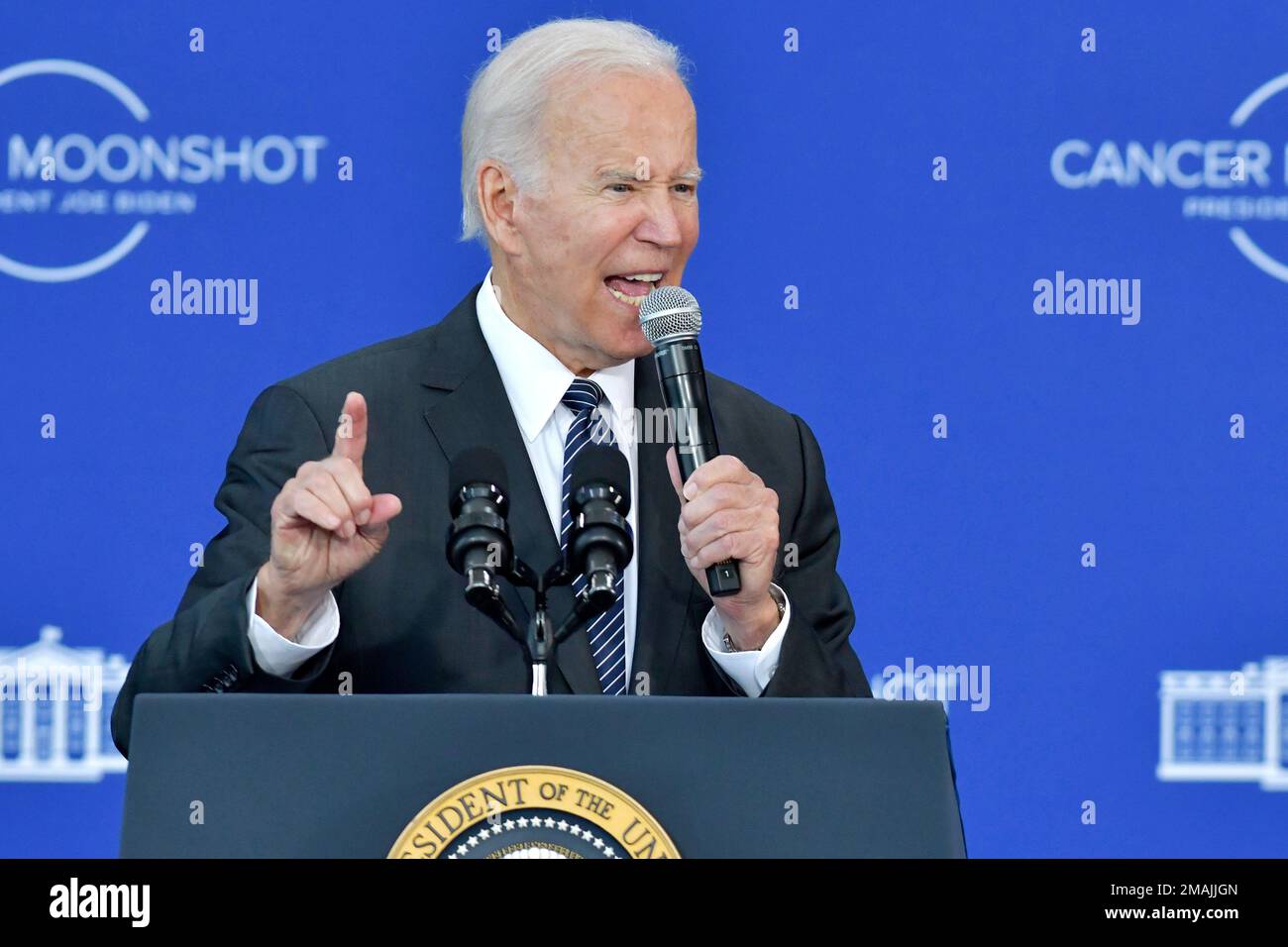 President Joe Biden addresses an audience at the John F. Kennedy ...