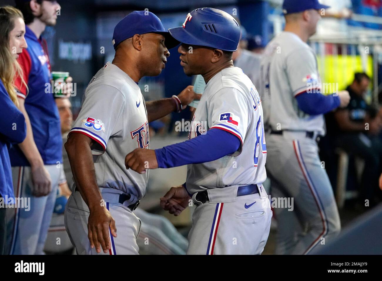 Texas Rangers interim manager Tony Beasley, left, greets first base ...
