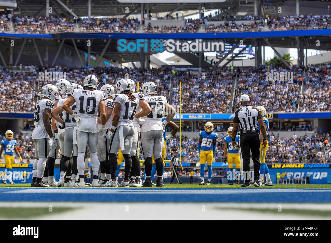 The Las Vegas Raiders huddle while playing against the Los Angeles ...