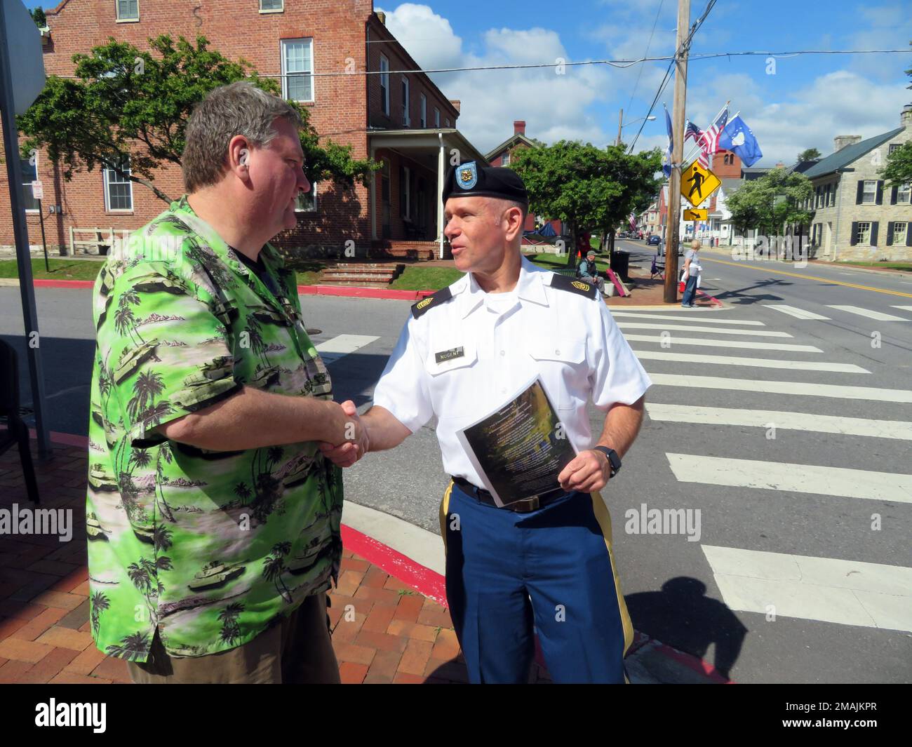 Retired Army Maj. Randy Short (L) shakes hands with Command Sgt. Maj ...