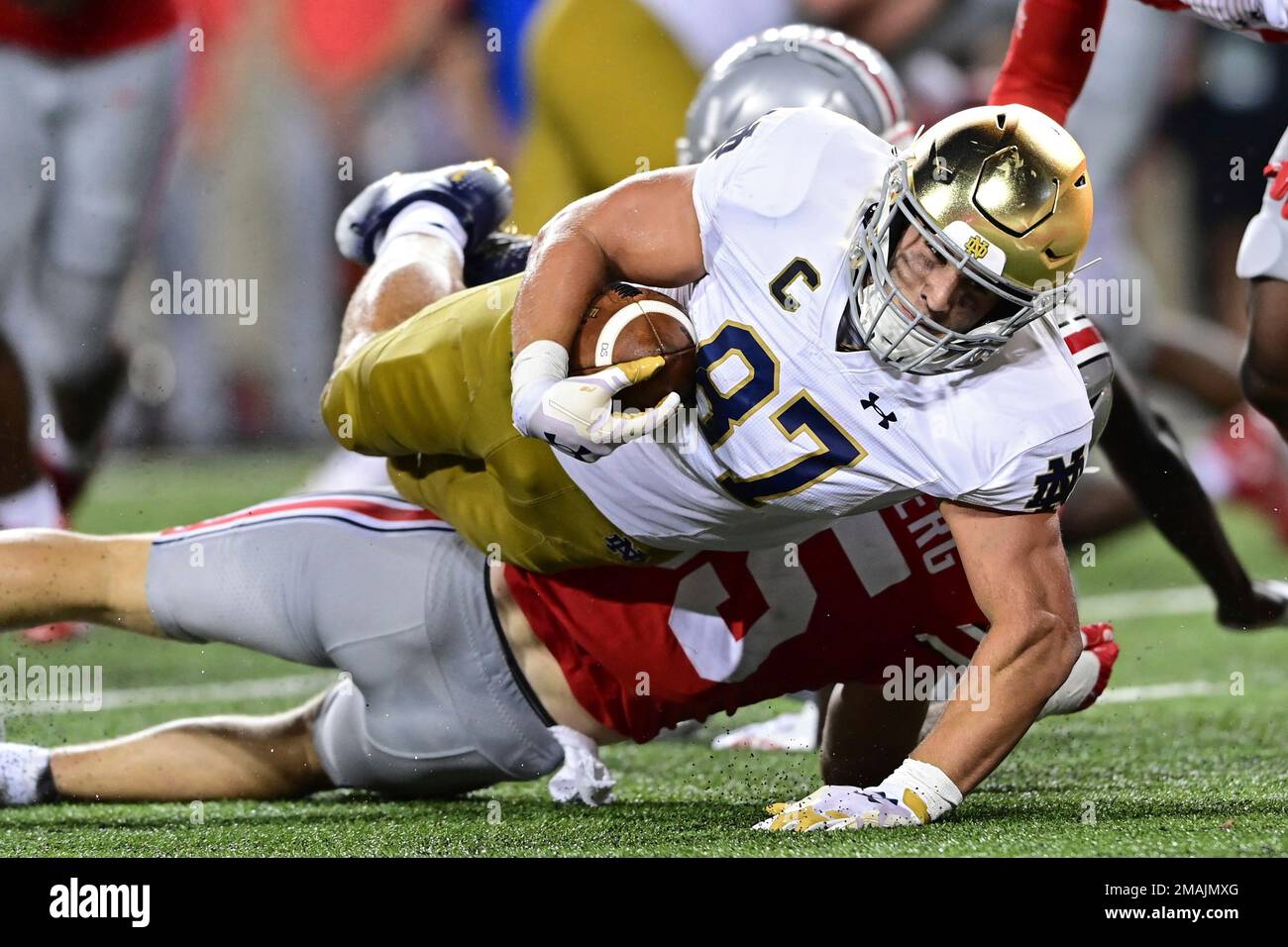 Notre Dame tight end Michael Mayer is tackled during the second quarter ...