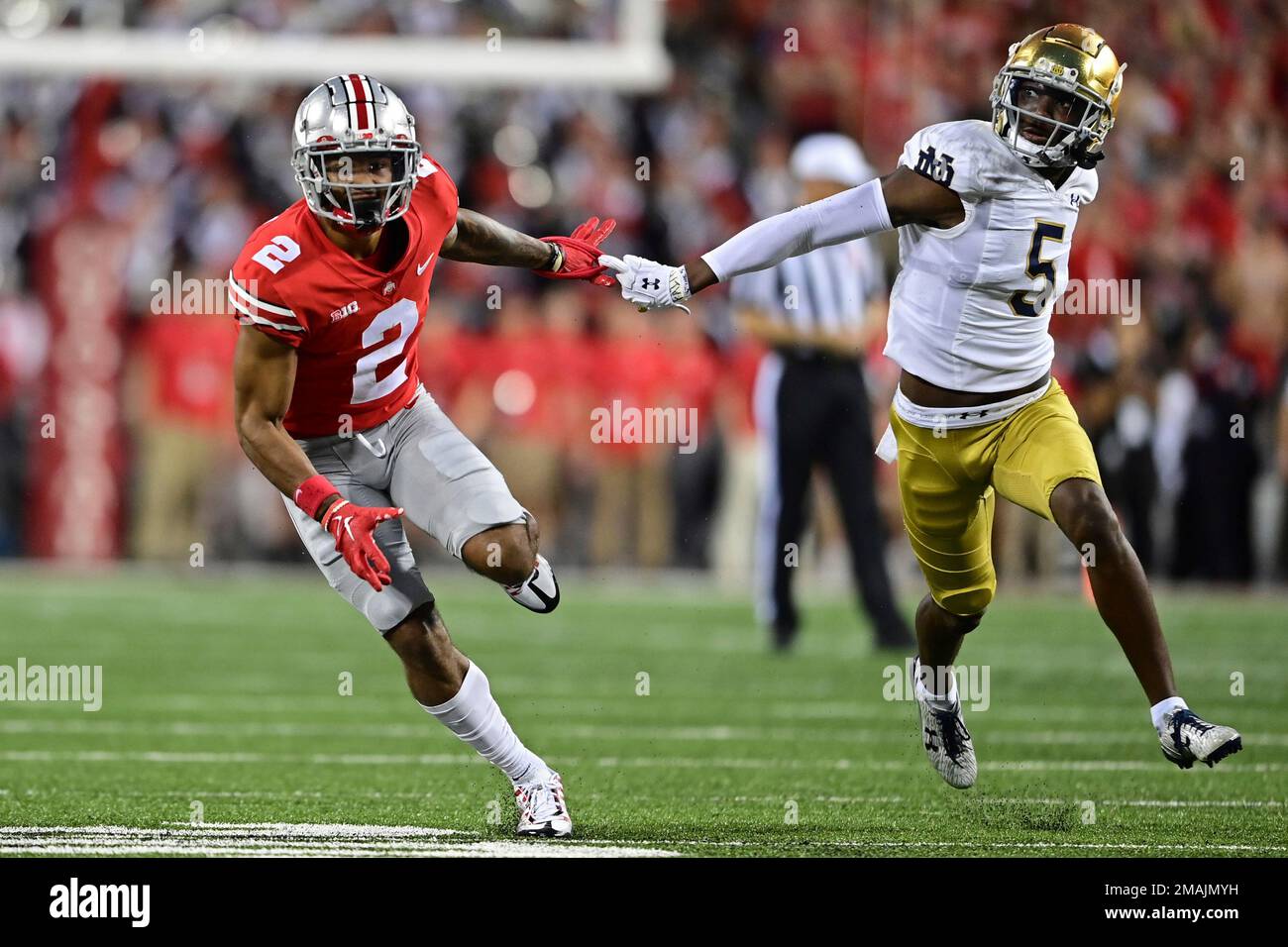 Ohio State wide receiver Emeka Egbuka is grabbed by Notre Dame ...