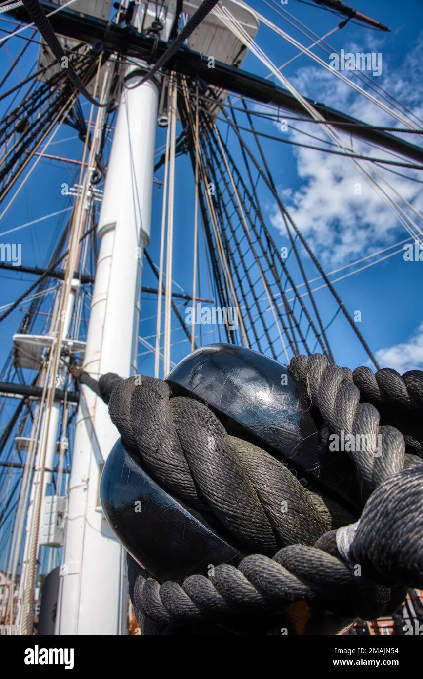 A vertical shot of a Classic Old Dutch Sailing Boat against a blue ...