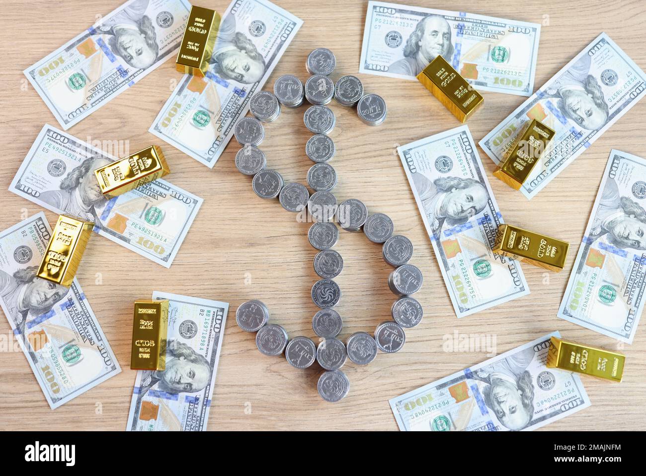 Coins in shape of dollar symbol and a lot of gold bars with US dollar ...