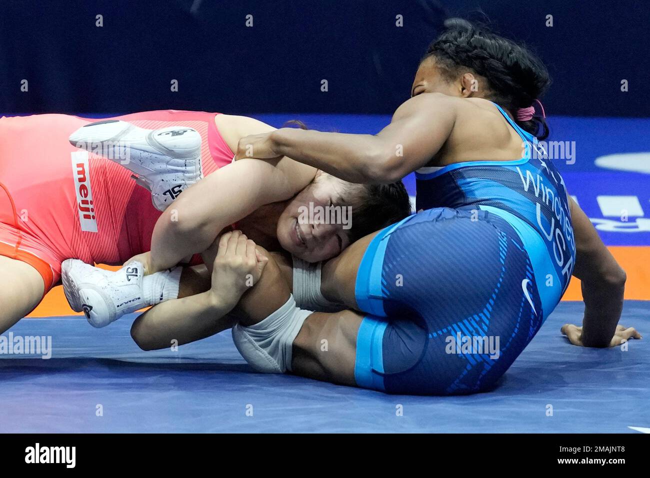 Japan's Mayu Shidochi Mukaida, left, and Jacarra Gwenisha Winchester of USA compete in their ...